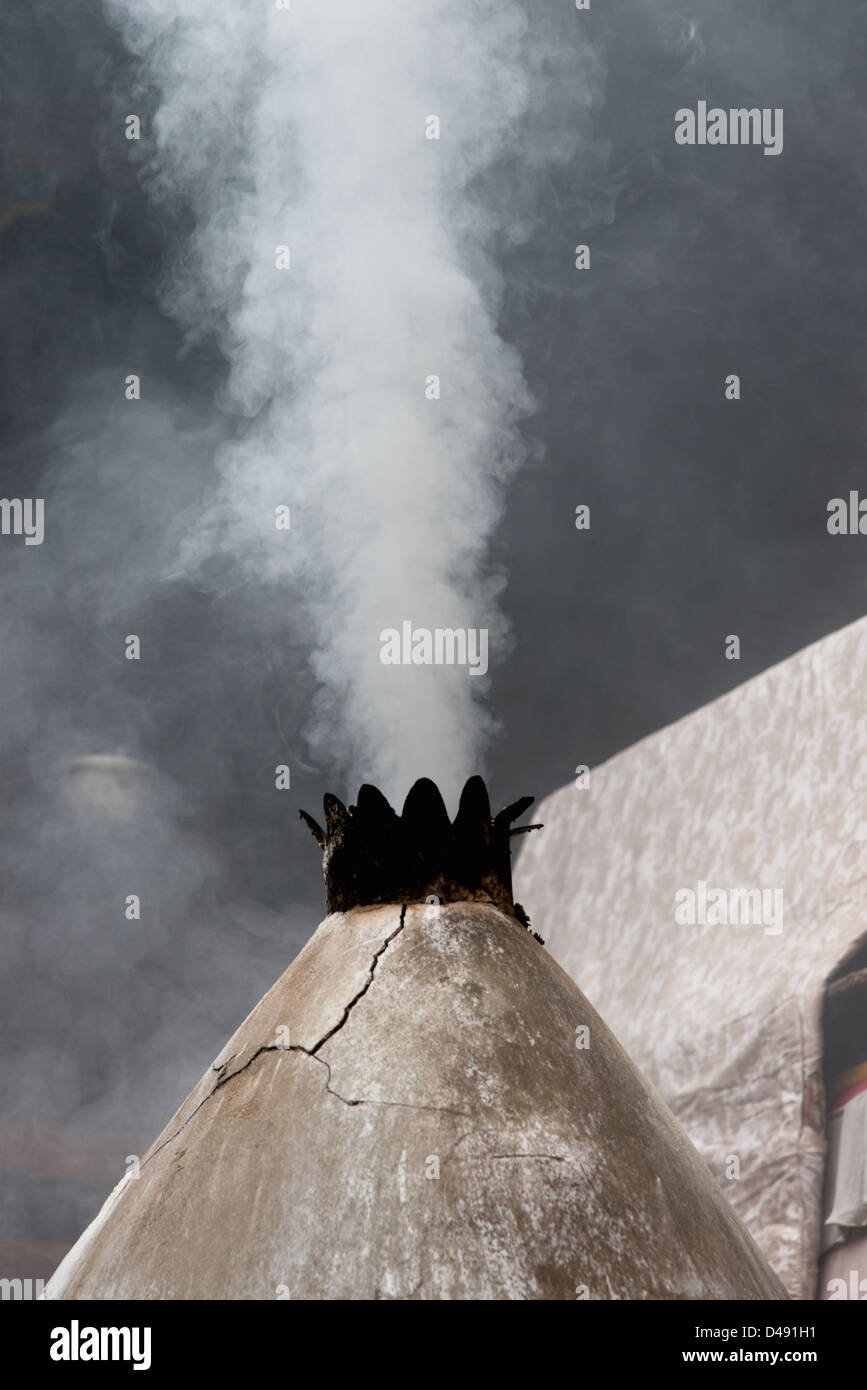 Smoke coming out of a stone cone structure;Lhasa xizang china Stock ...
