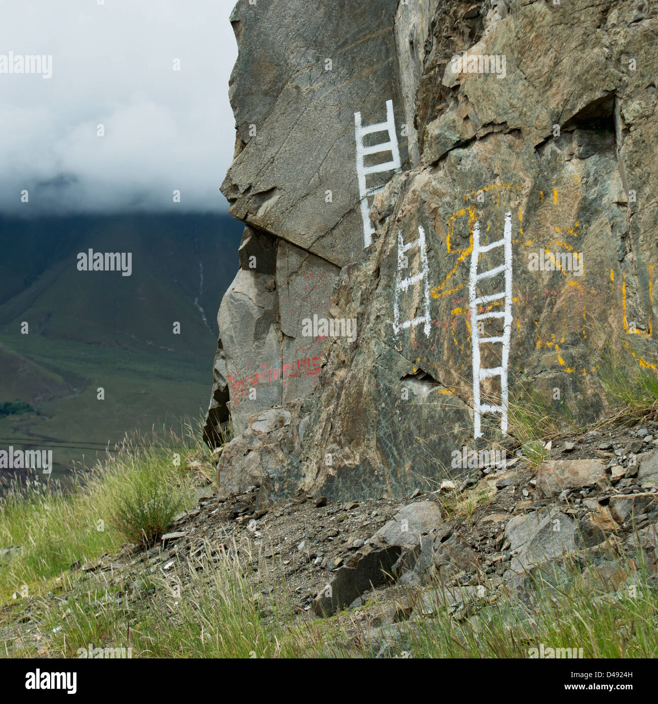 White ladders painted on the side of a steep rock cliff;Xizang china ...