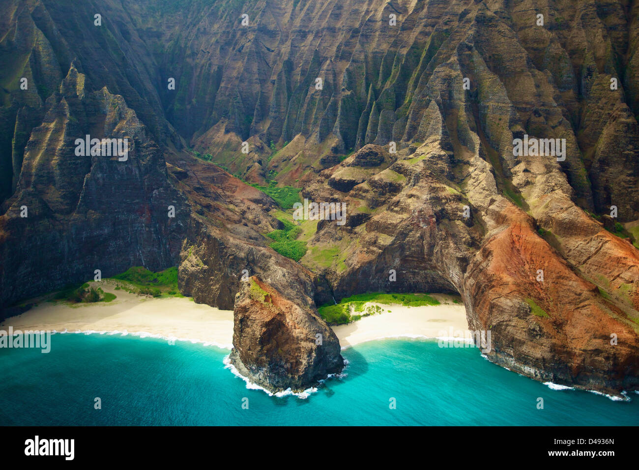 Blue Water And White Sand In A Small Inlet Along A Rugged Coastline ...