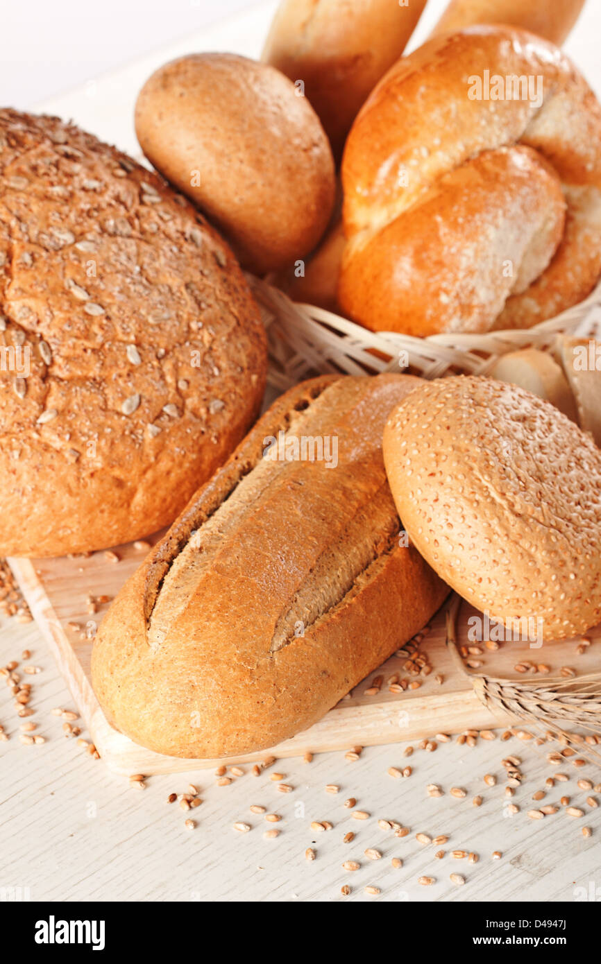 Assortment of baked bread on white background Stock Photo - Alamy