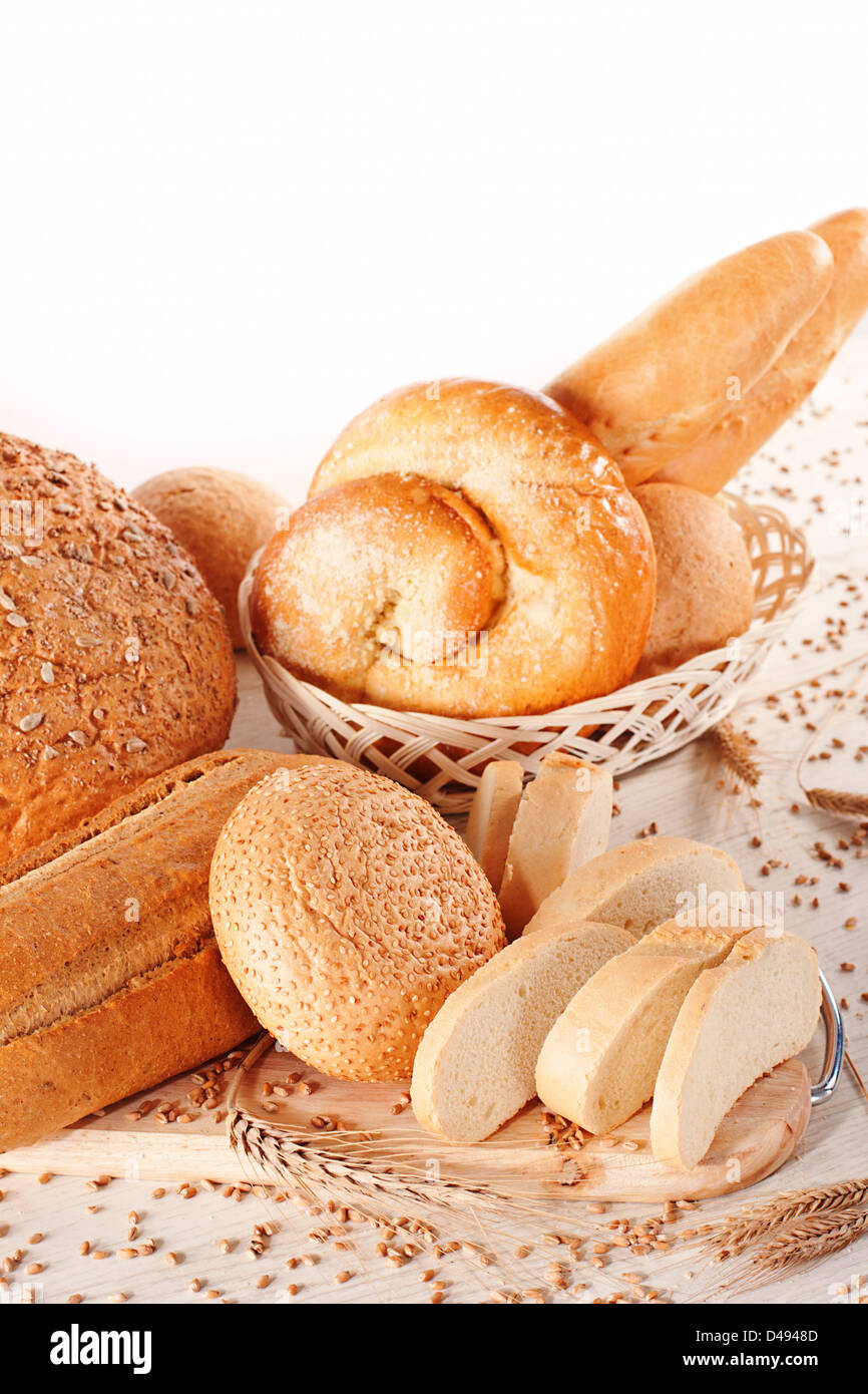 Assortment of baked bread on white background Stock Photo - Alamy