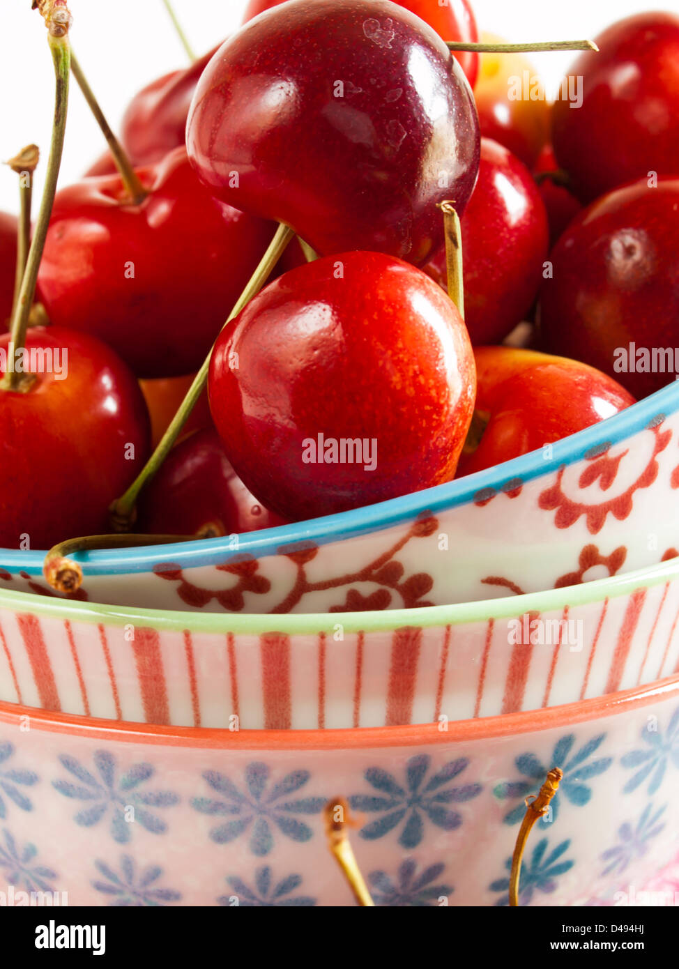 Freshly picked heap of cherries in bowl Stock Photo - Alamy