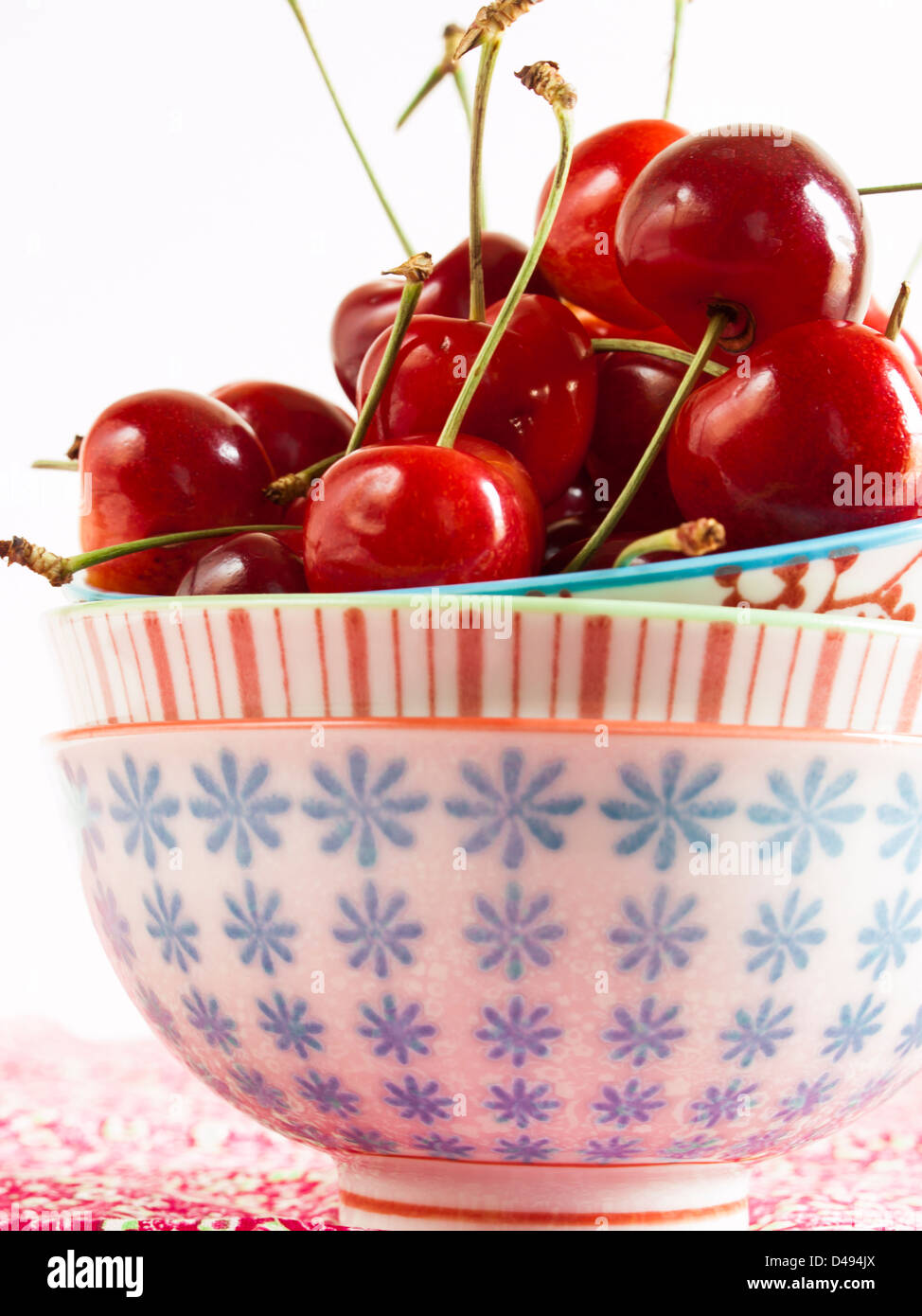 Freshly picked heap of cherries in bowl Stock Photo - Alamy