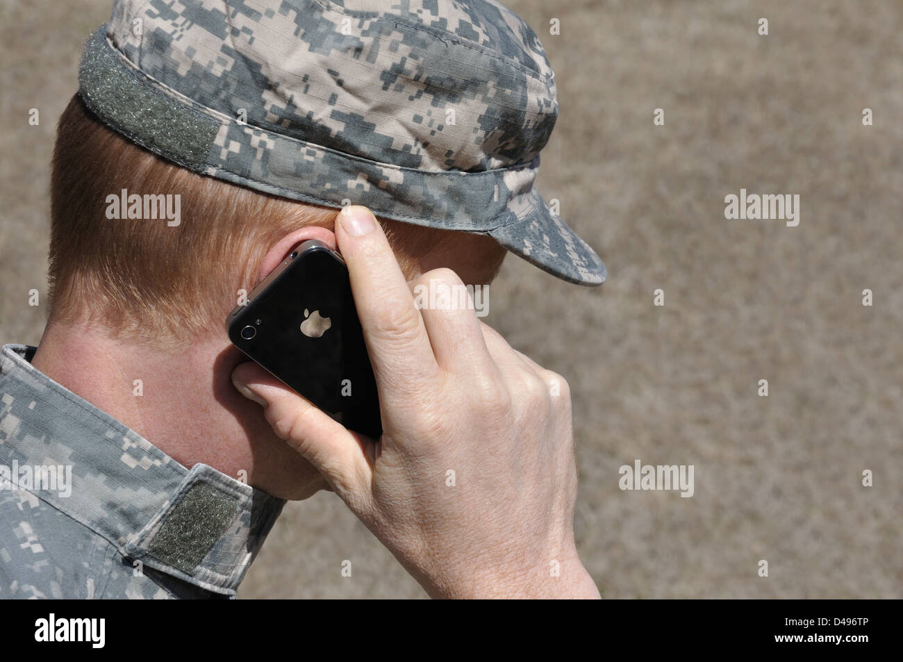 Soldier with iPhone making phone call Stock Photo - Alamy