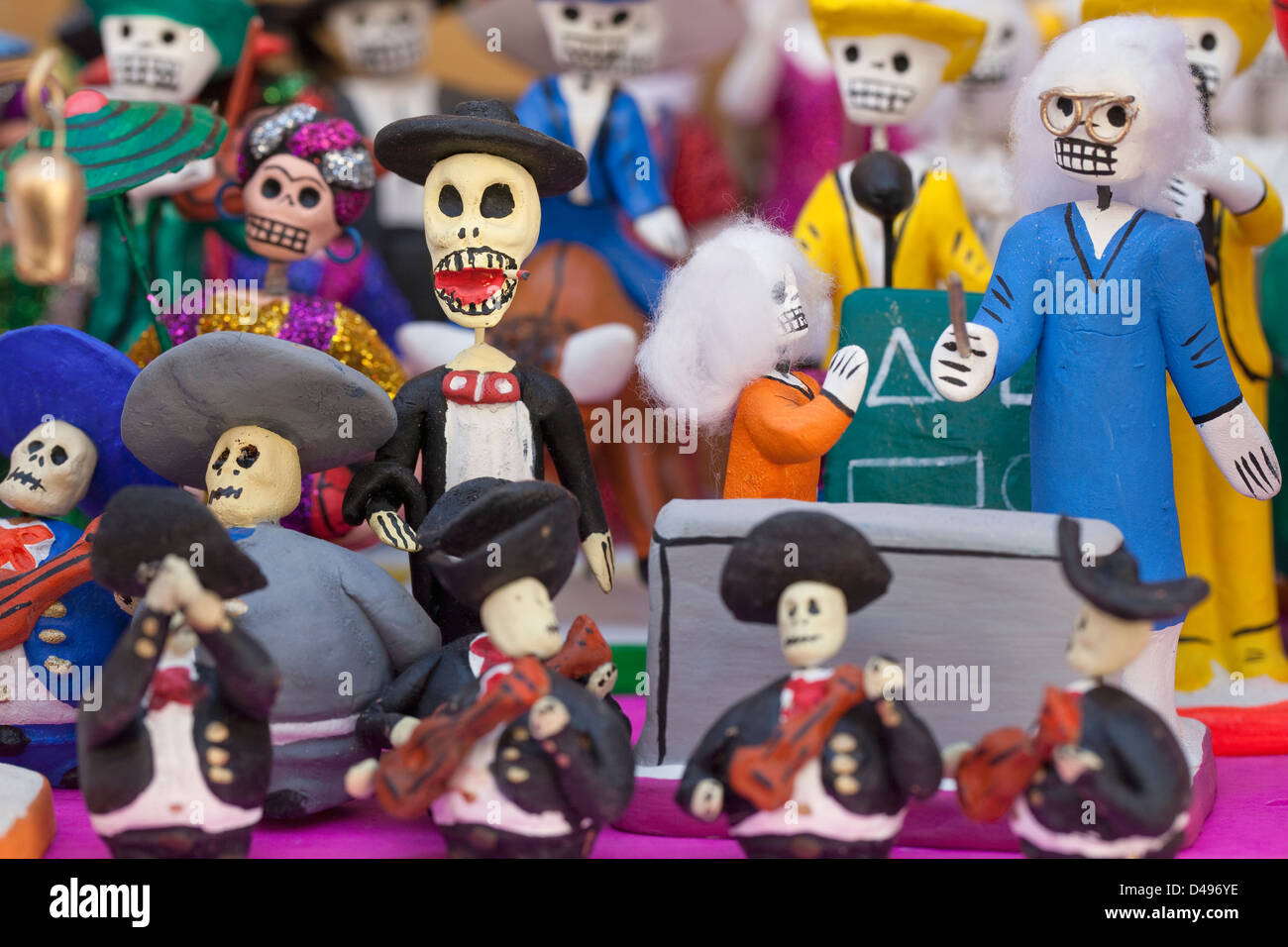 Small clay skeleton figurines on display for Day of the Dead festival ...
