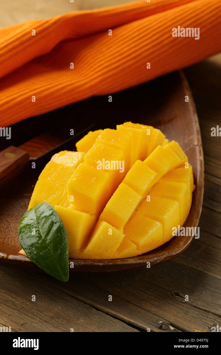 fresh fruit mango on wooden plate Stock Photo - Alamy