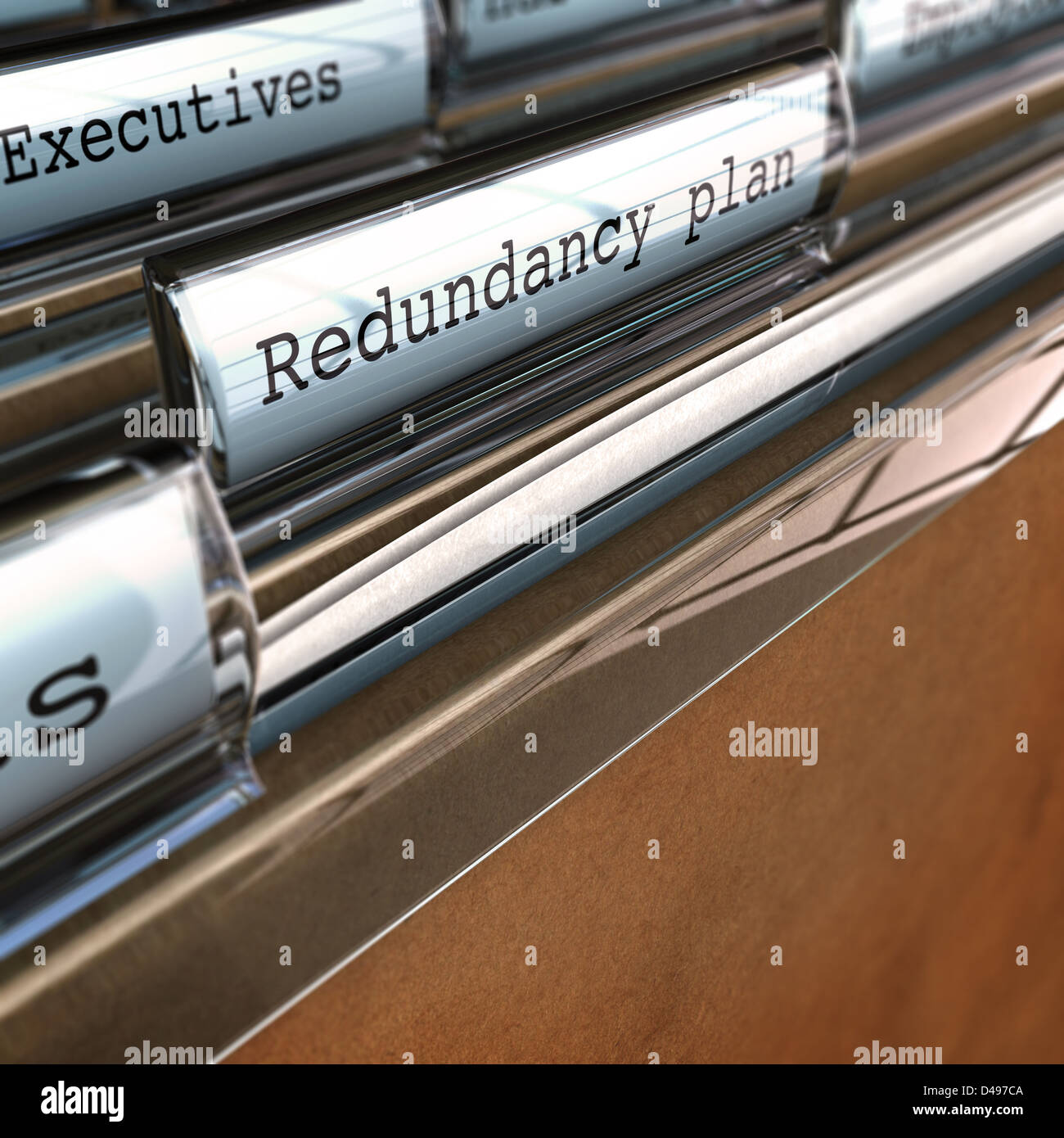 redundancy plan written on a folder with the word executives at the ...