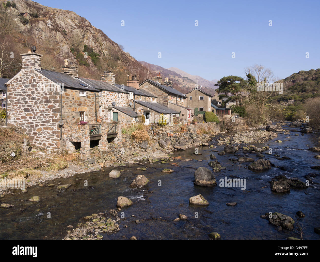 Back view of riverside terraced houses on riverbank close to Afon ...