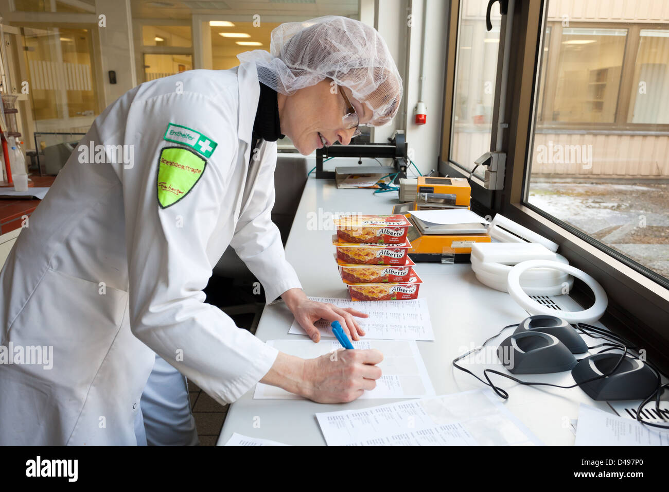 Berlin, Germany, who works in the food control at Freiberger food Stock ...
