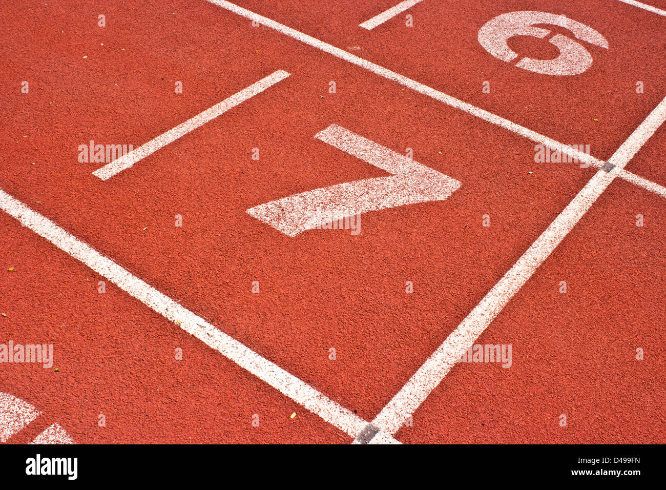 Number seven on the start of a running track Stock Photo - Alamy