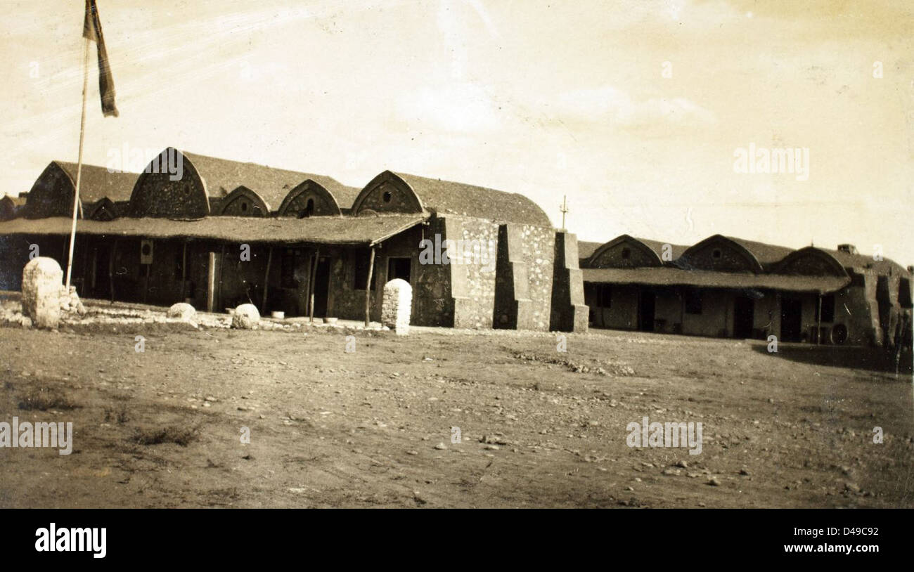 A photograph by Edwin Newman depicting the headquarters and officer's ...