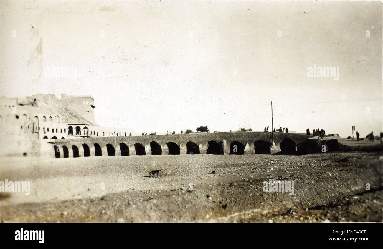 A bridge crossing a river in Iraq, with a clear view of the surrounding ...