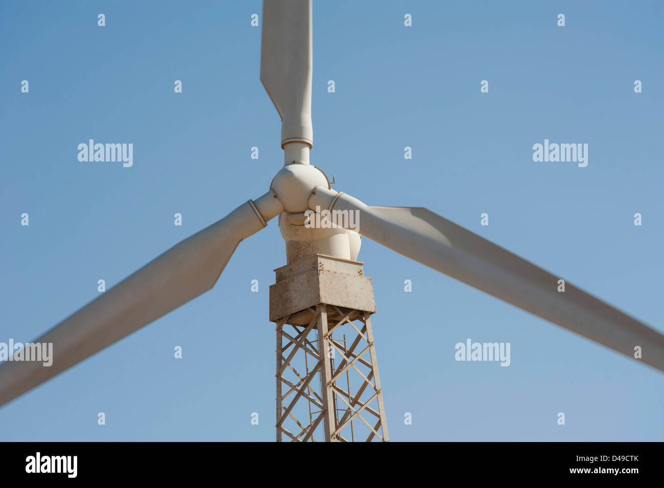 Electric wind turbine generator against a blue sky background Stock ...