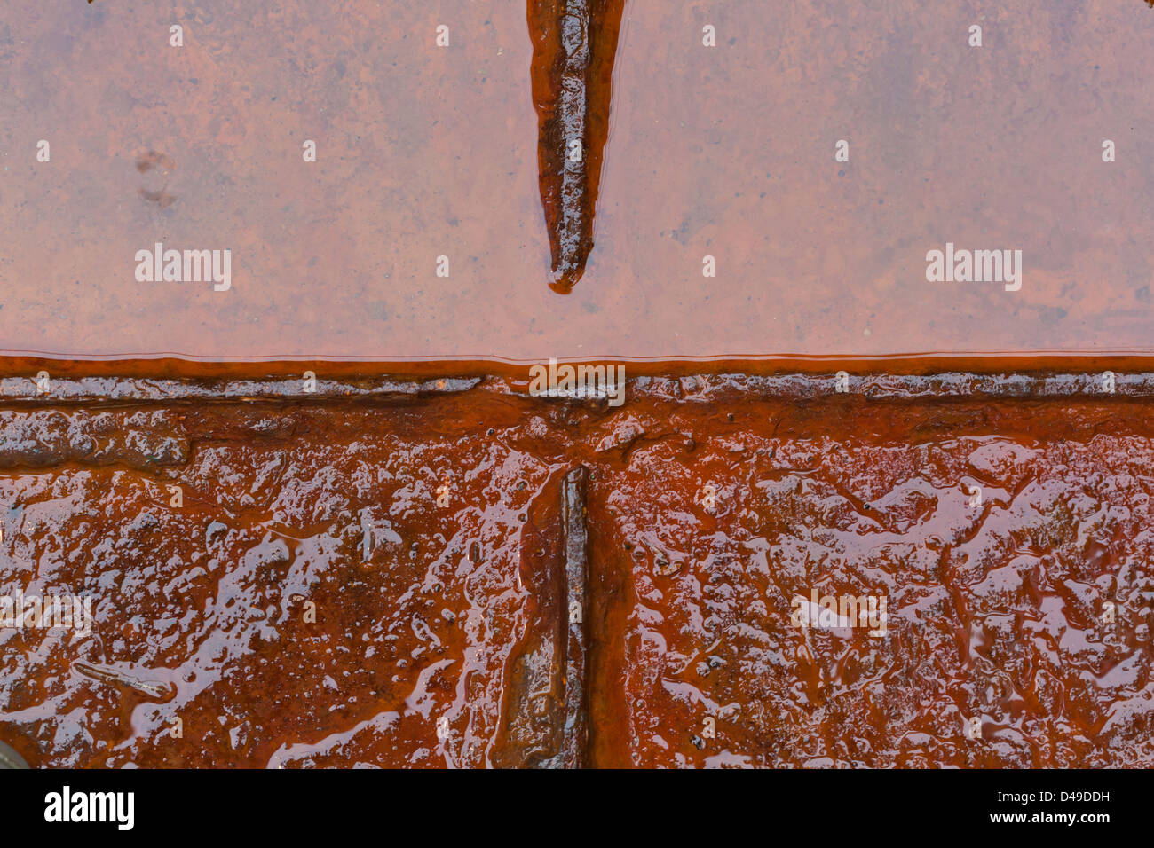 Wet rusty piece of iron Stock Photo - Alamy