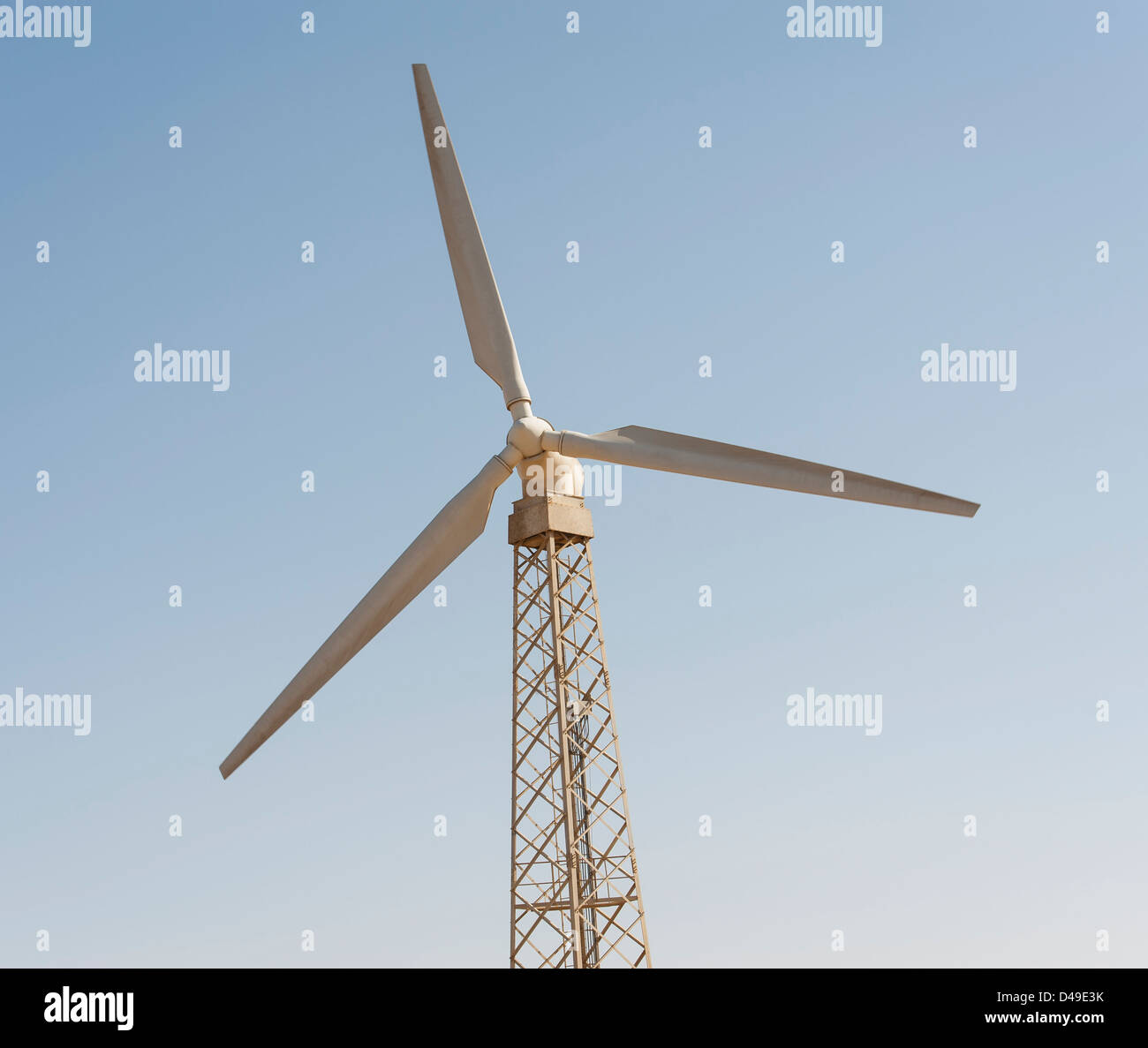 Electric wind turbine generator against a blue sky background Stock ...