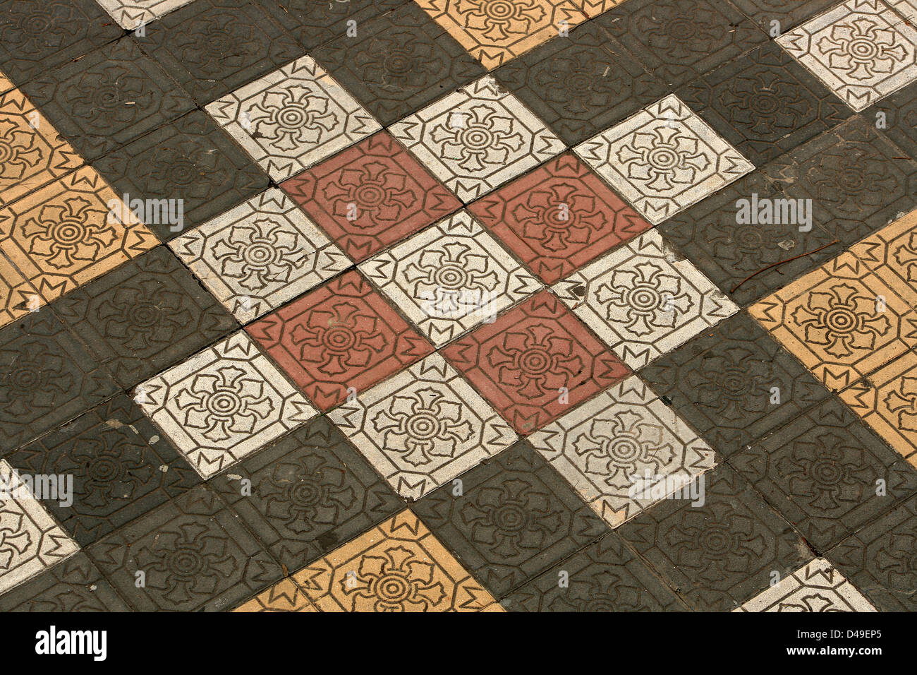 Stamped paving tiles in an abstract pattern of colors in the town ...