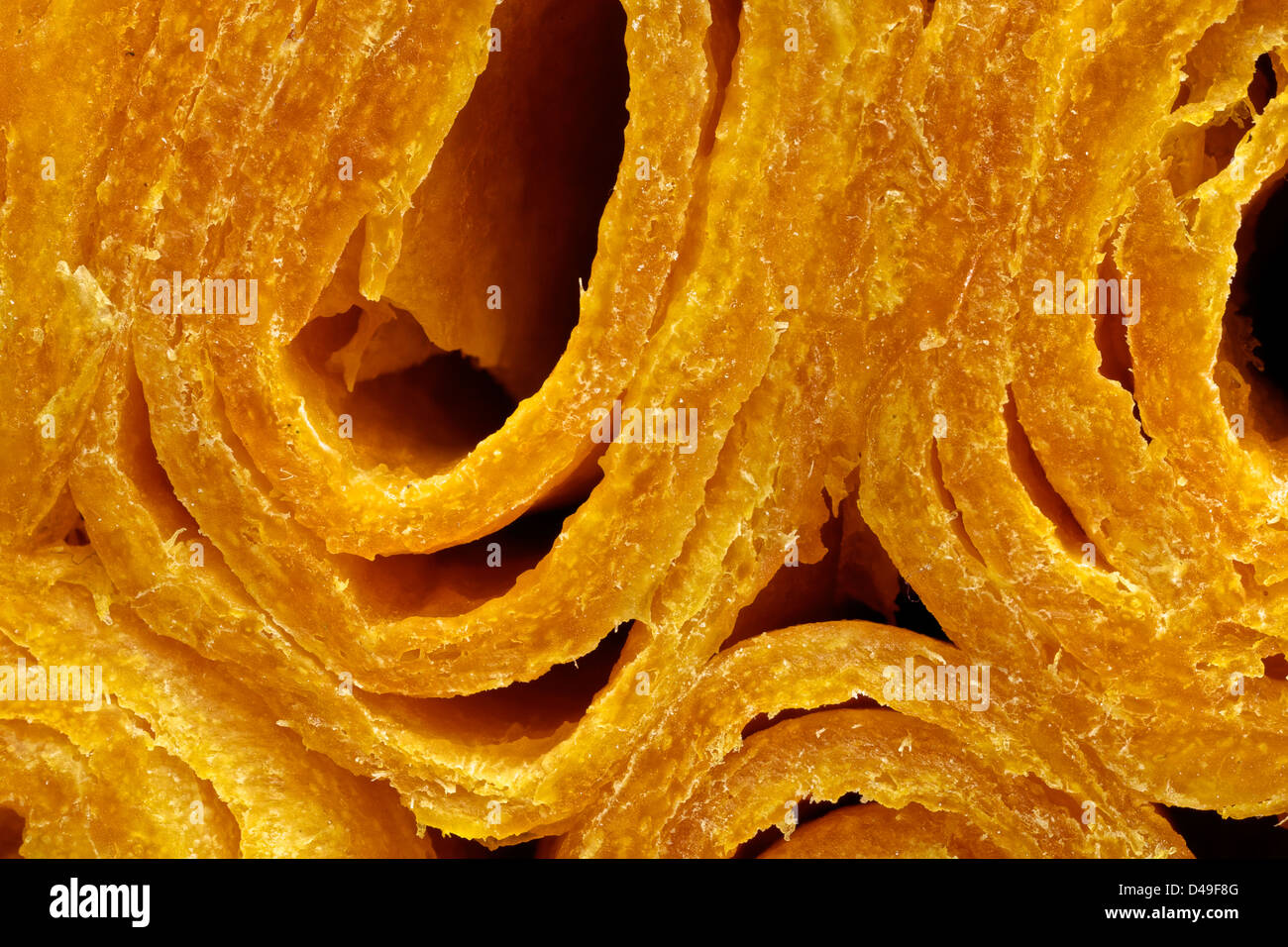 Close up Spiral of Orange Dried Mango Stock Photo - Alamy