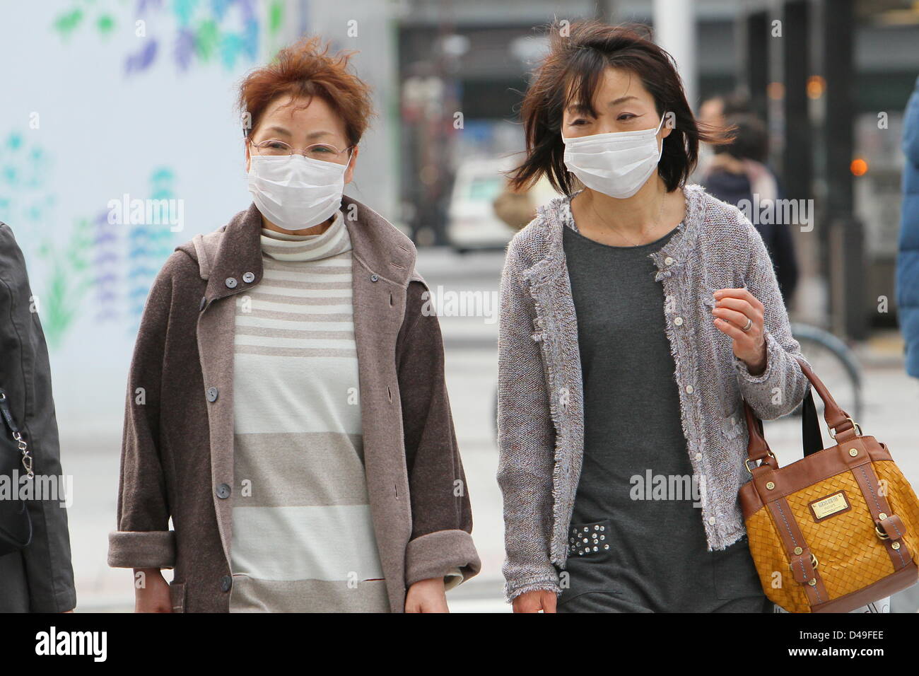 March 8, 2013, Tokyo, Japan : Two women are seen wearing protective ...