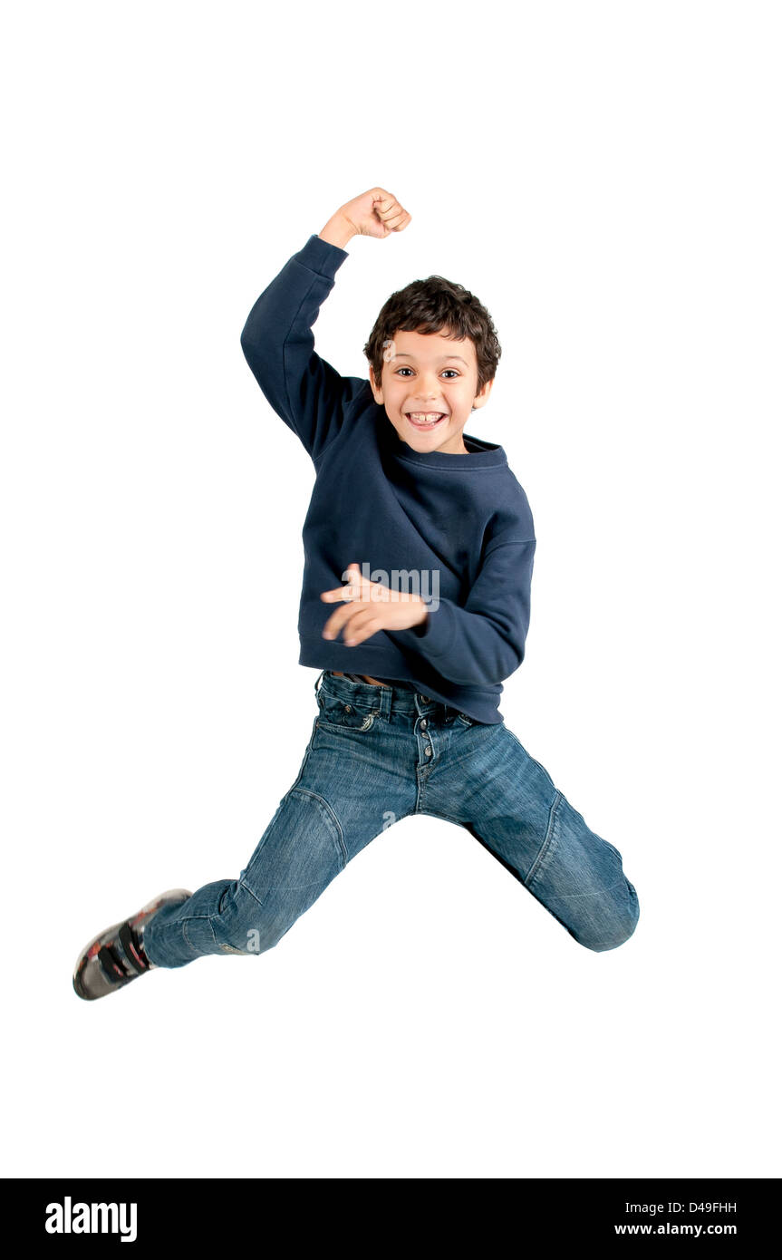 Young boy jumping isolated in white Stock Photo - Alamy