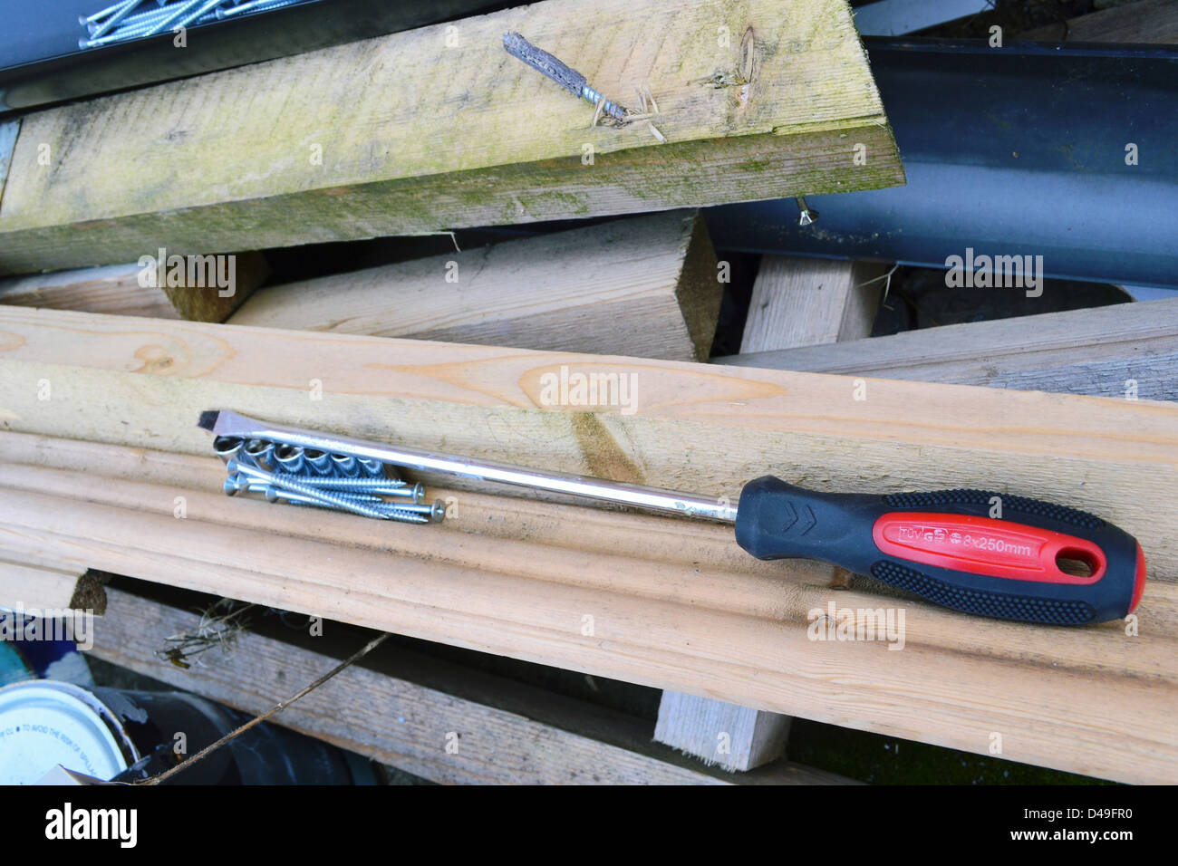 Screwdriver and wood Stock Photo - Alamy