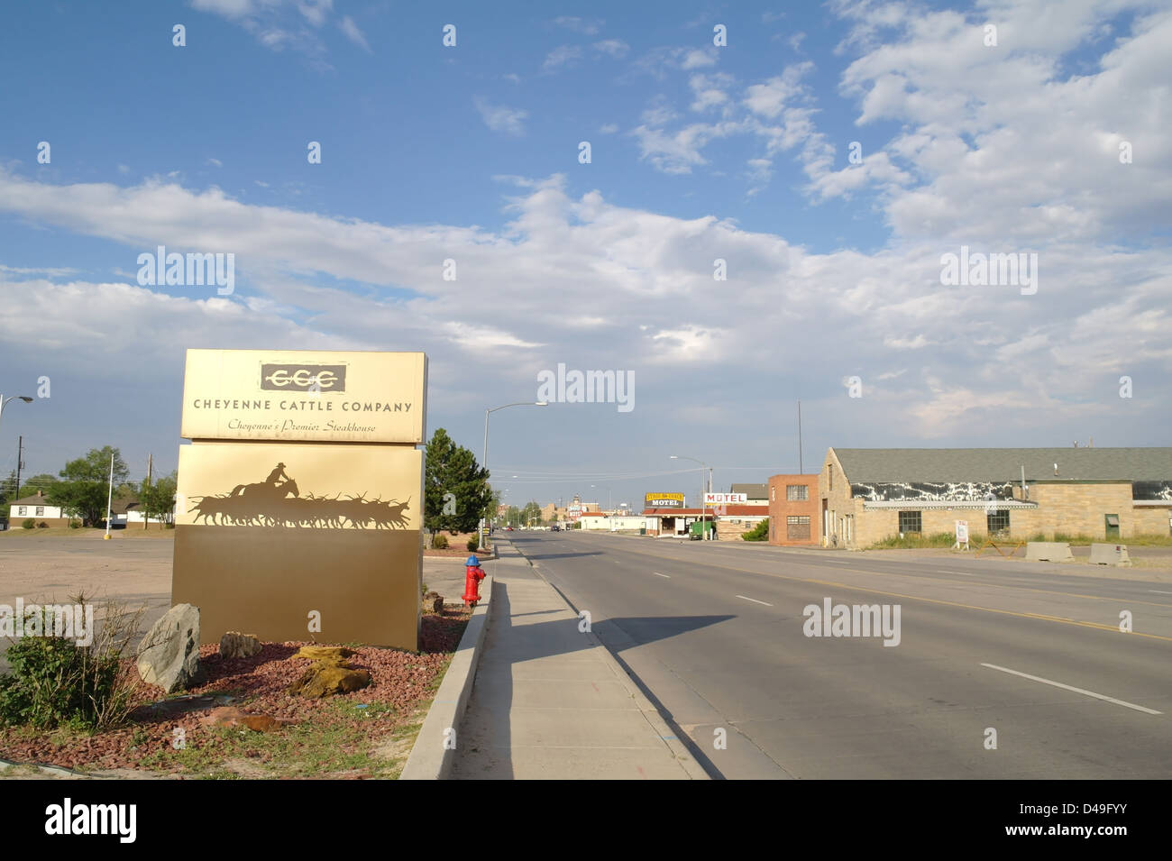 Blue sky clouds evening sun 'Cheyenne Cattle Company' steakhouse sign ...