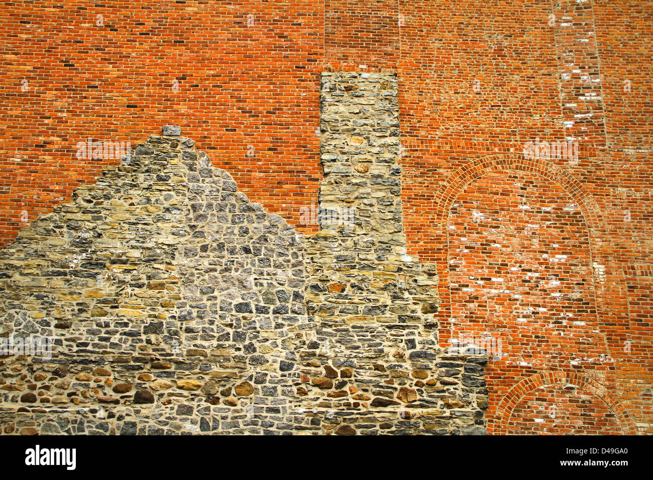 brick wall built over an old stone wall Stock Photo - Alamy