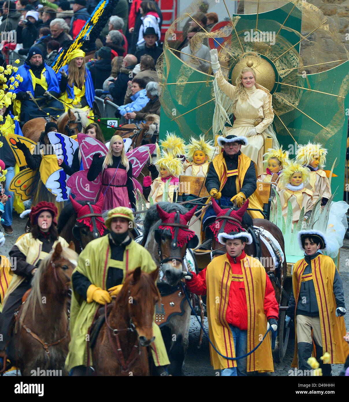 People view a parade of floats at the traditional spring festival ...