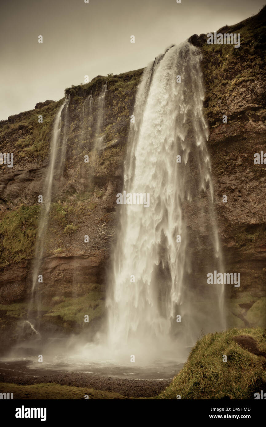 Seljalandsfoss Waterfall, southern part of Iceland, at overcast weather ...