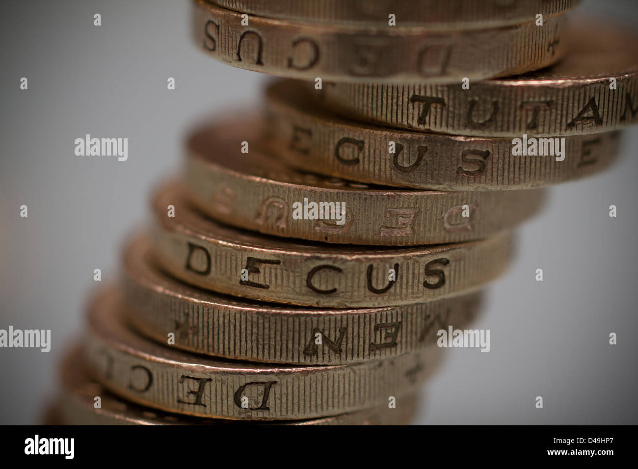 A balanced stack of pound coins, representing the sterling currency of ...