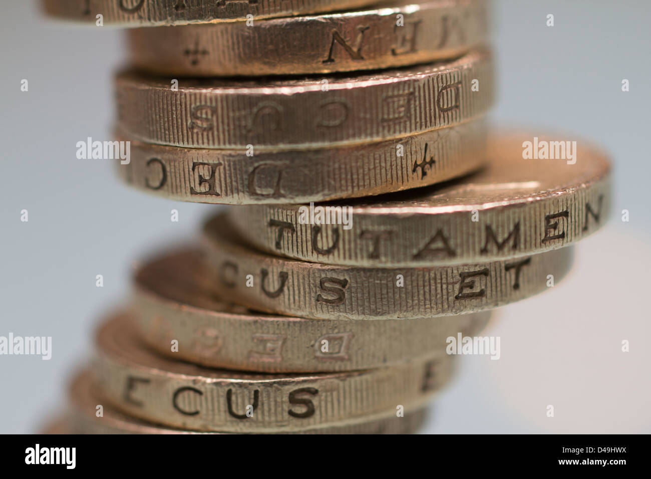 A balanced stack of pound coins, representing the sterling currency of ...