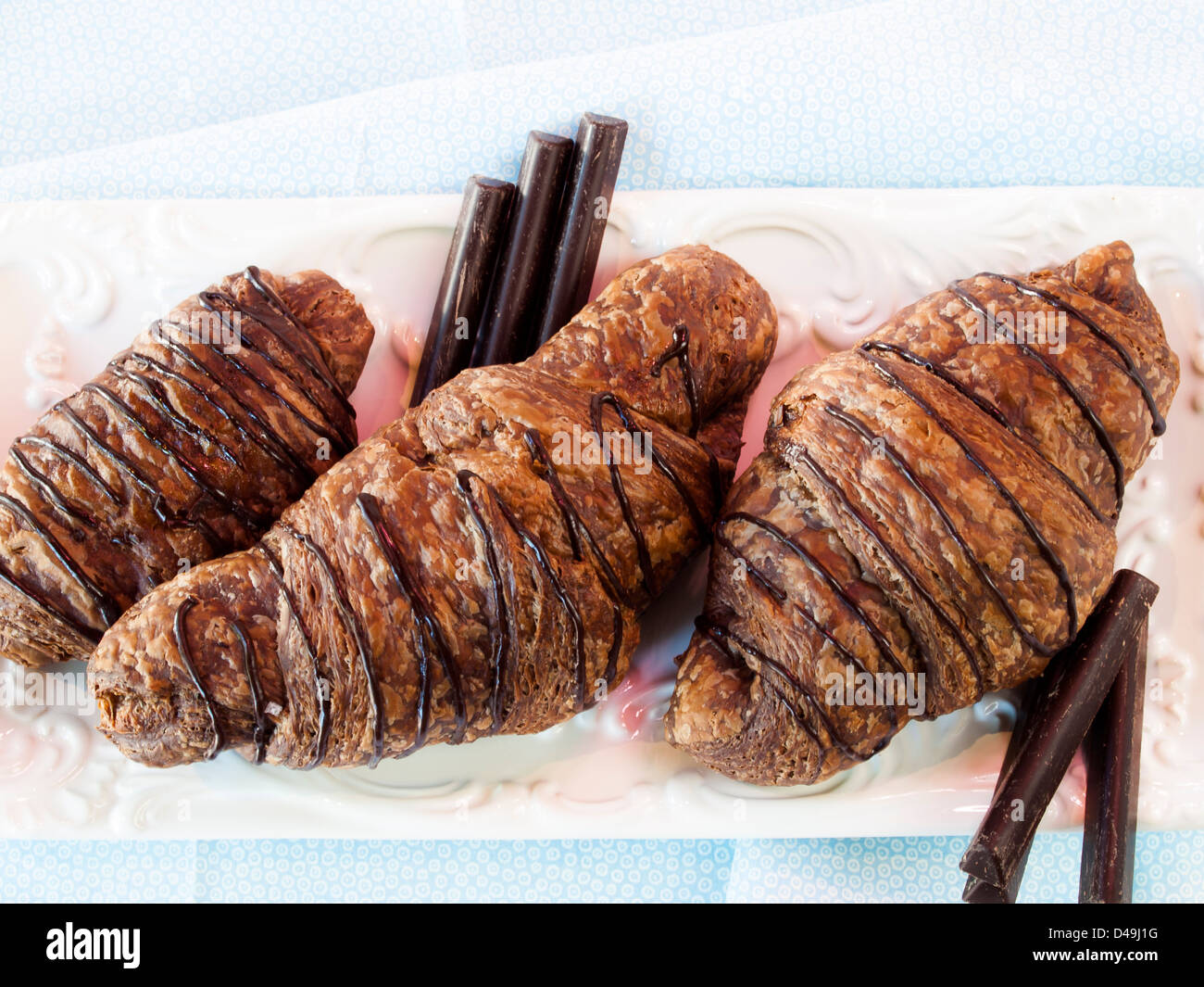 The dough is layered with butter, rolled and folded several times in ...