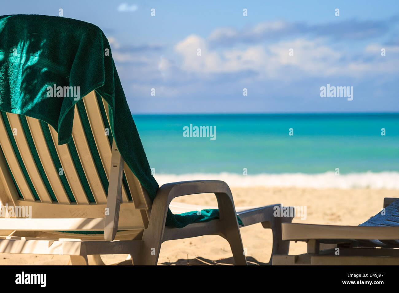 beach chair and towel facing the sea Stock Photo - Alamy
