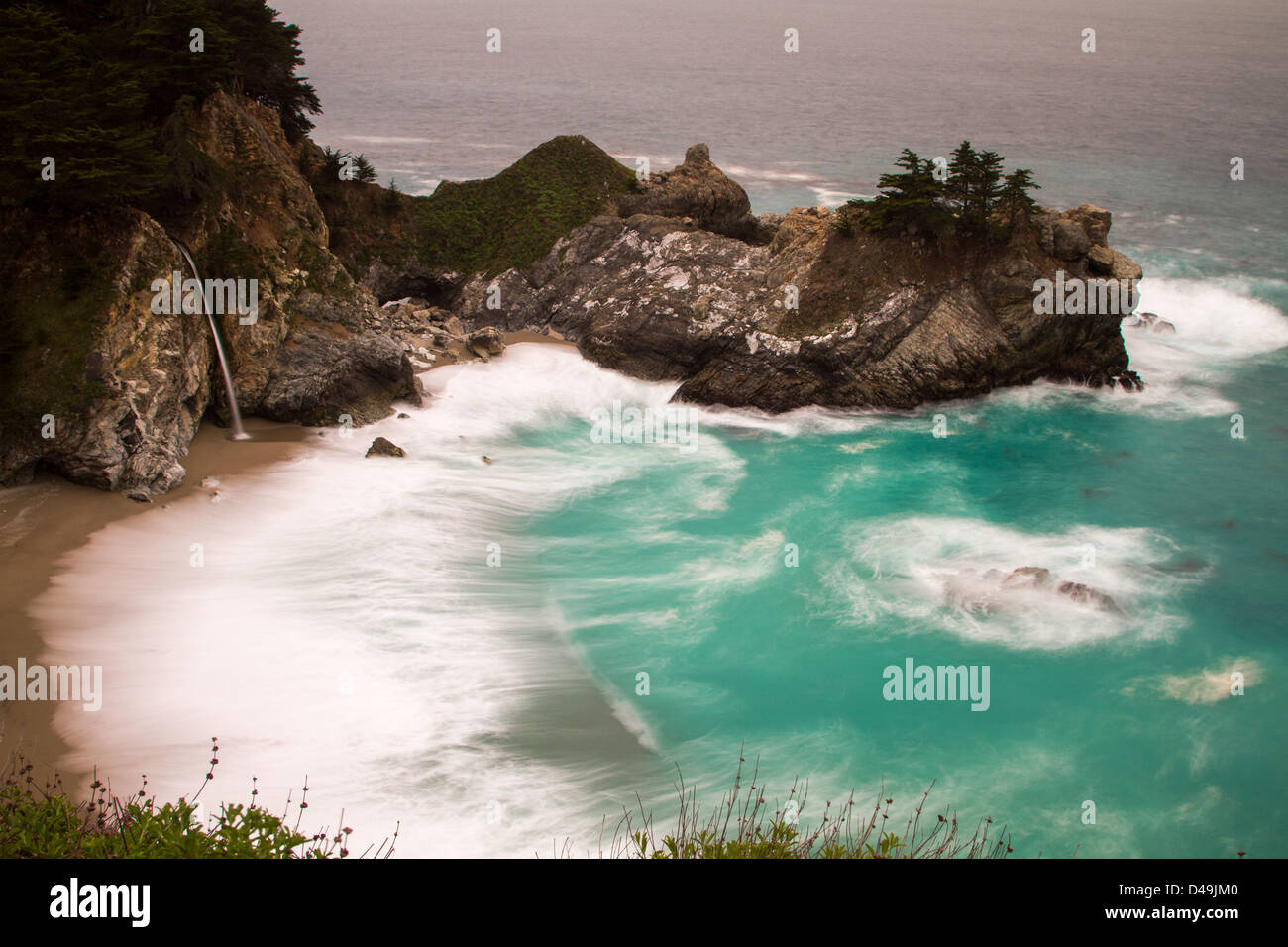 Long exposure shot of the lovely McWay Falls and beach in Big, Sur ...