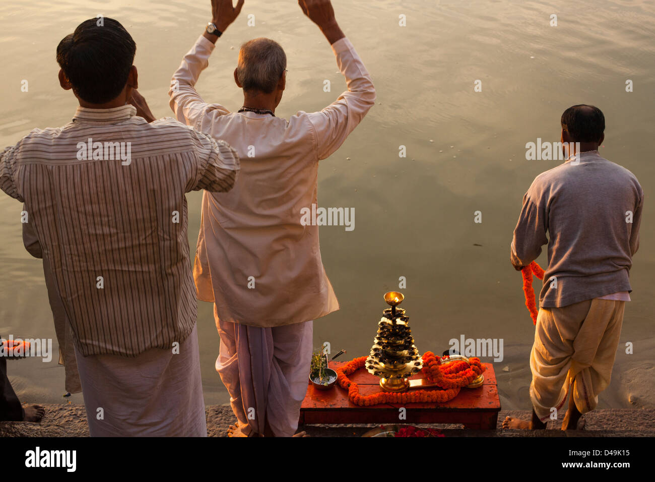 Hindu ritual ceremony at dawn on the Ganges River, Varanasi, Uttar ...