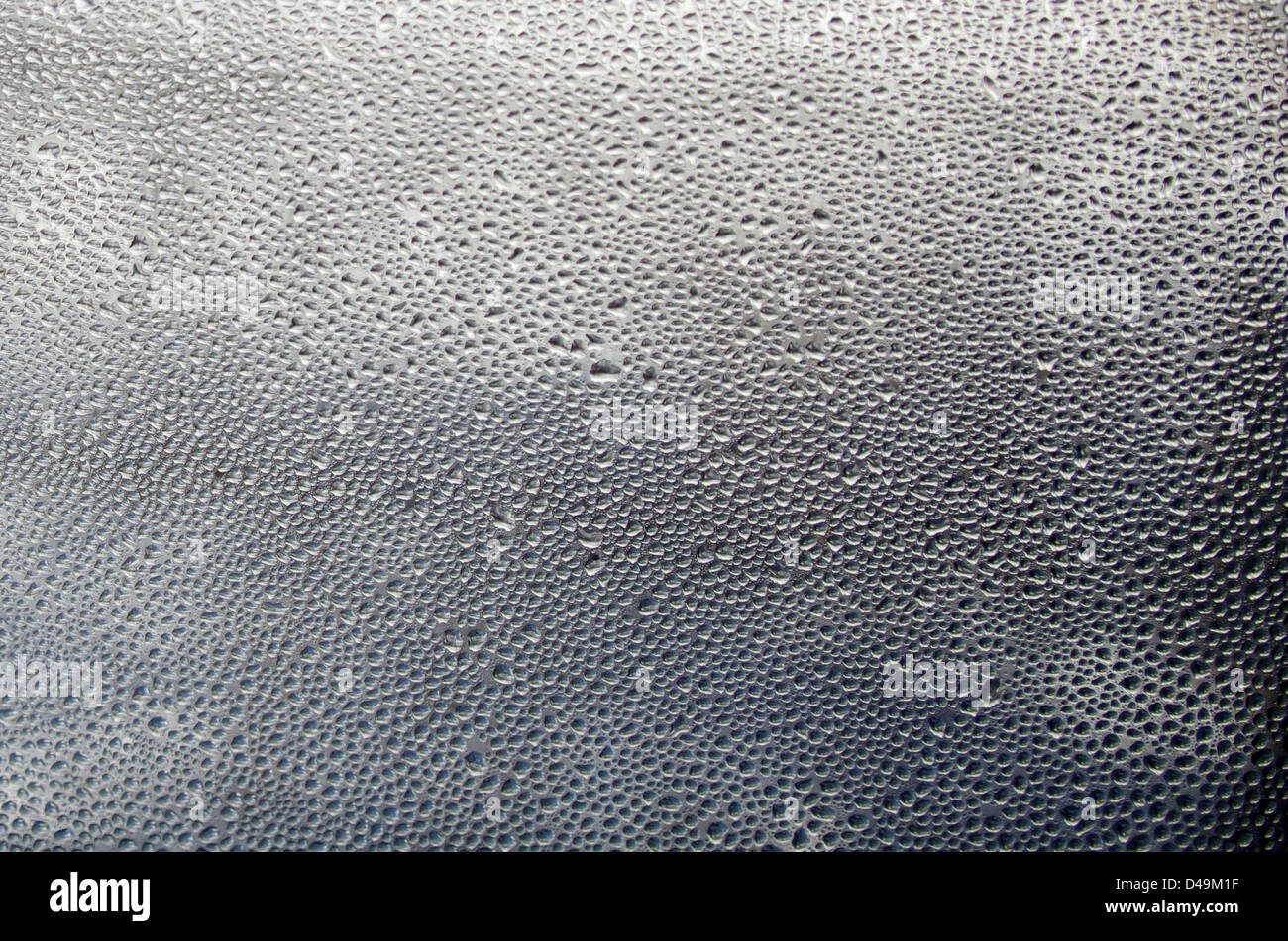Warm air condensing on a cold window pane Stock Photo - Alamy