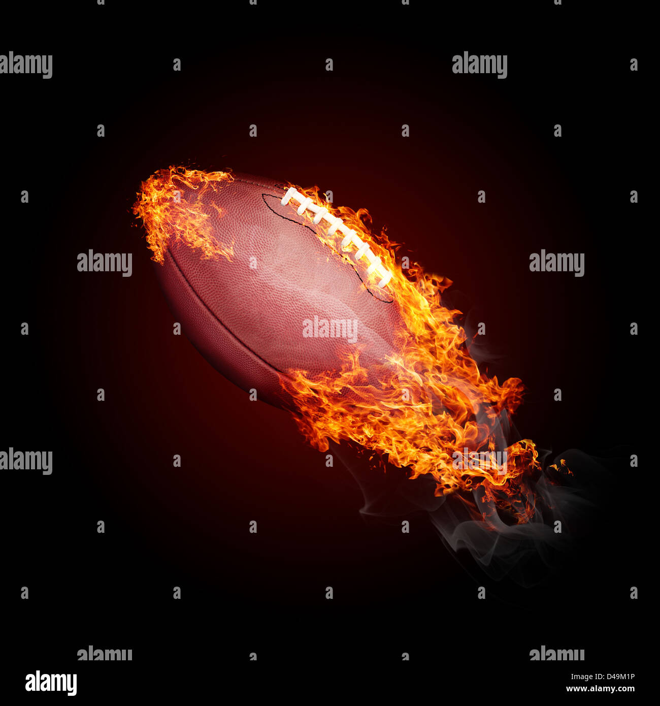 American football ball in fire isolated on black background - flying up ...