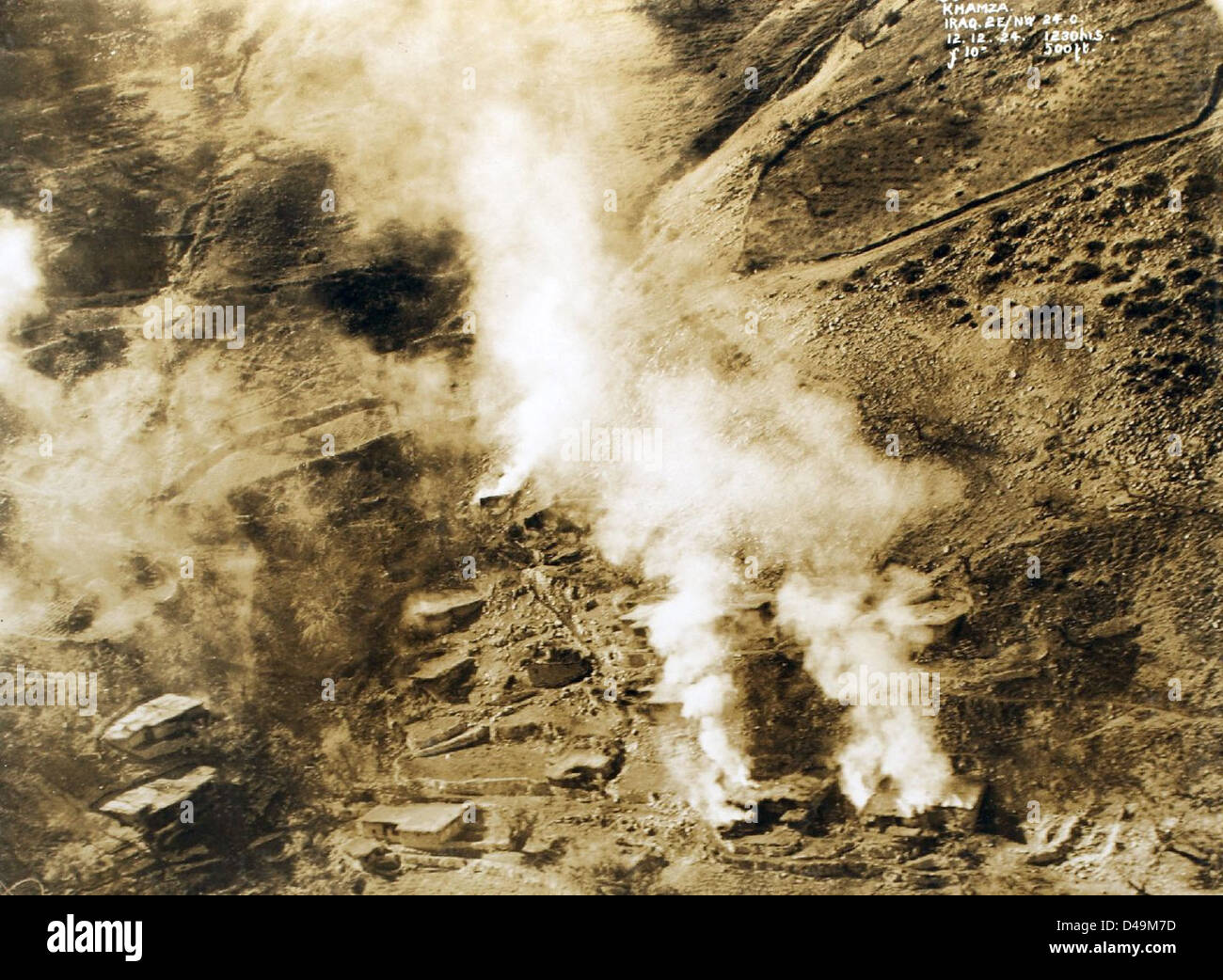 The image shows the aftermath of the destruction of Khamza village in ...