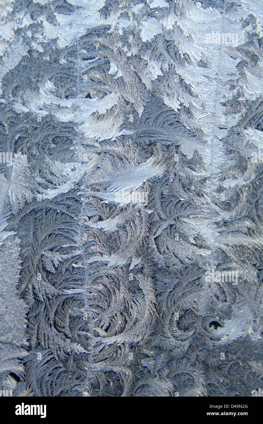 Elaborate patterns of frost on a window pane Stock Photo - Alamy