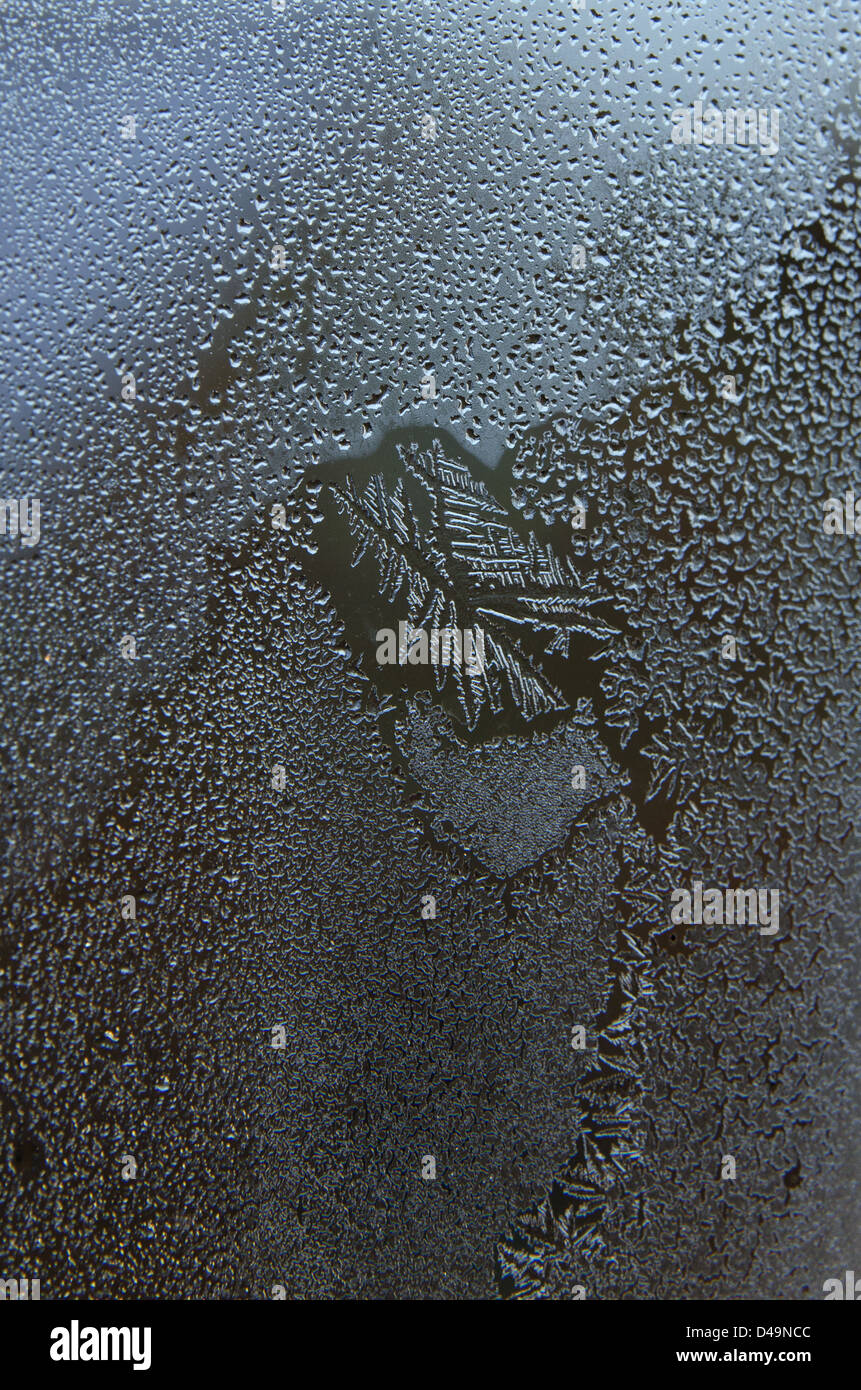 Frost melting on a window pane Stock Photo - Alamy