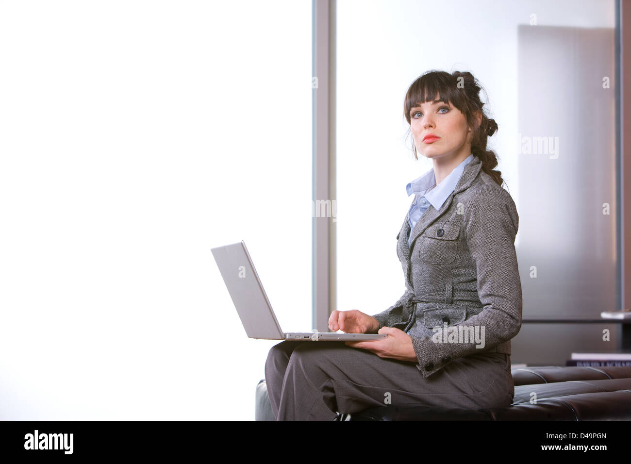 Business woman laptop in modern office Stock Photo - Alamy