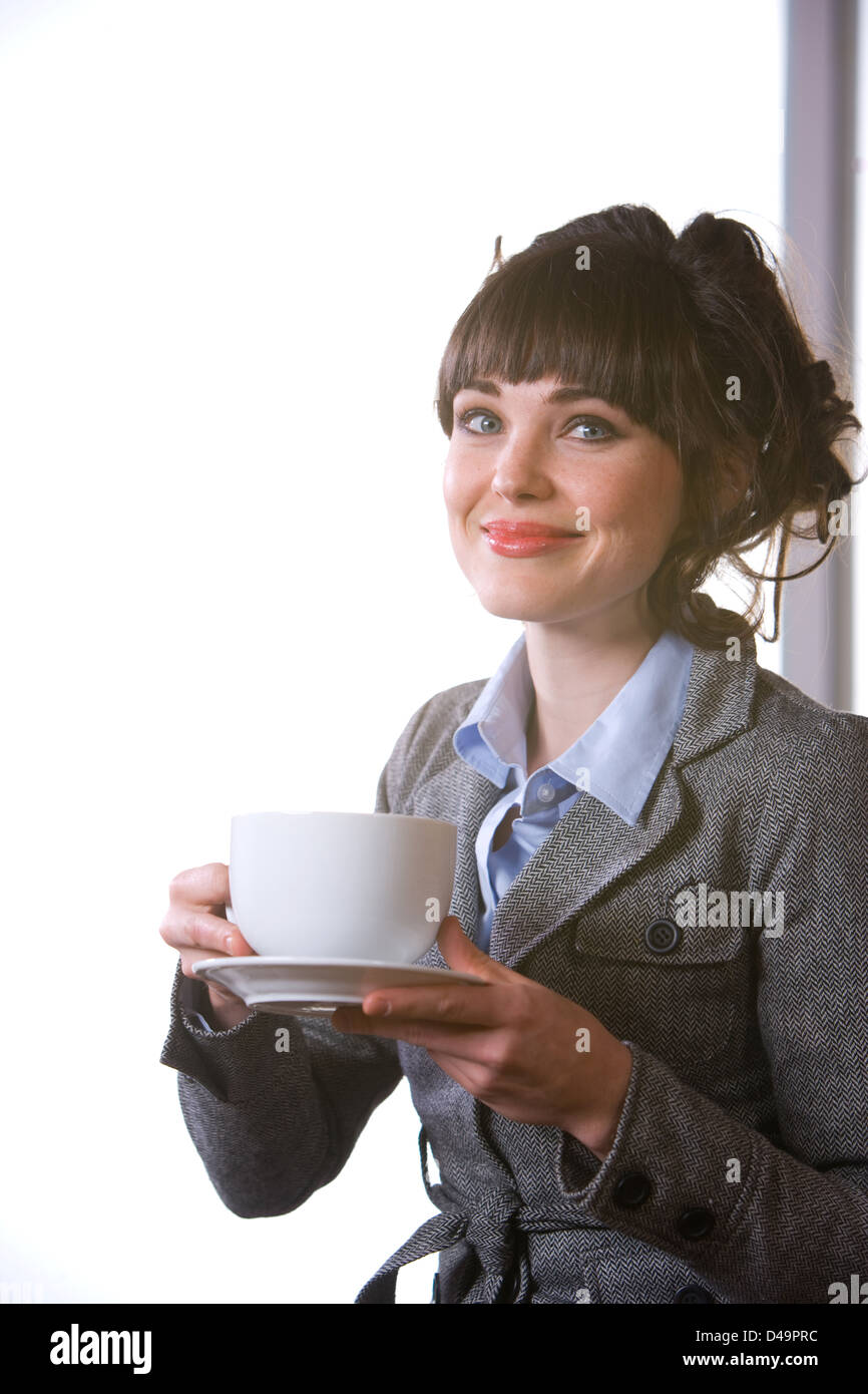 BUsiness woman having her morning coffee Stock Photo - Alamy