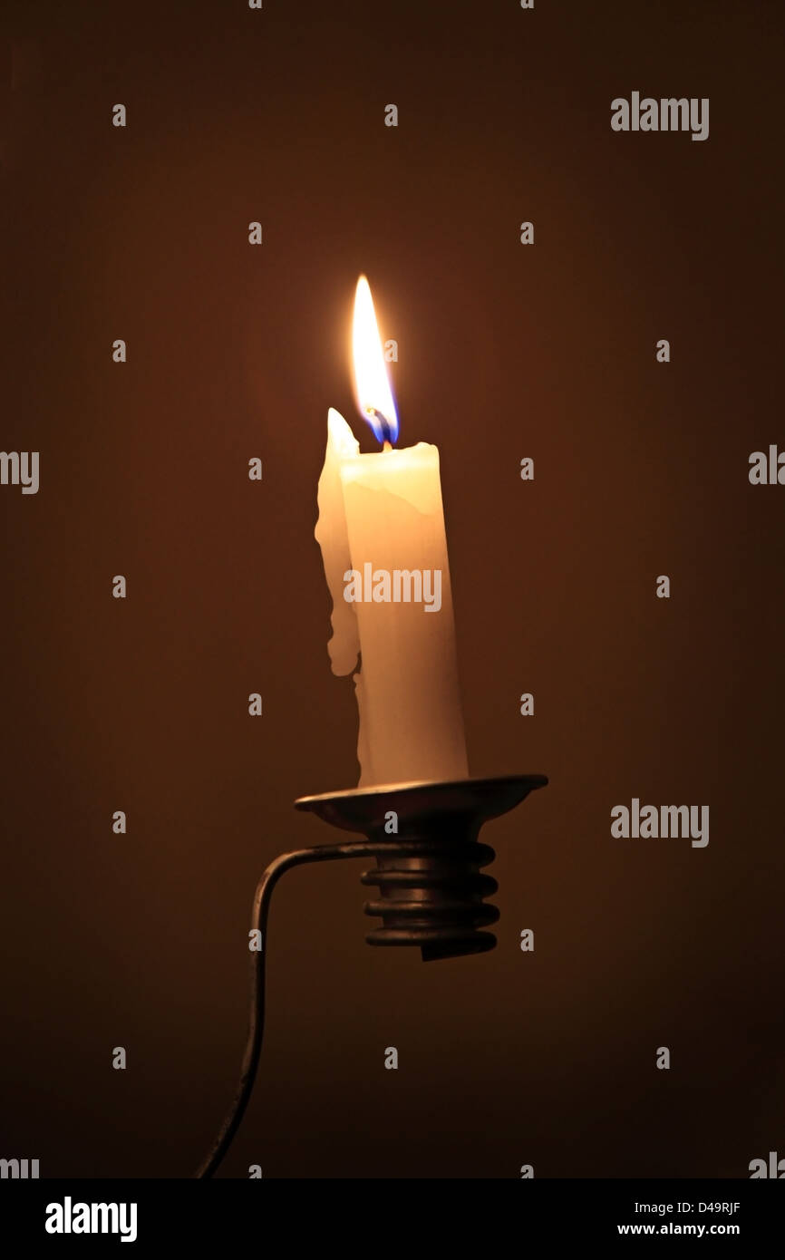 Single Lighting Candle dark background Stock Photo - Alamy