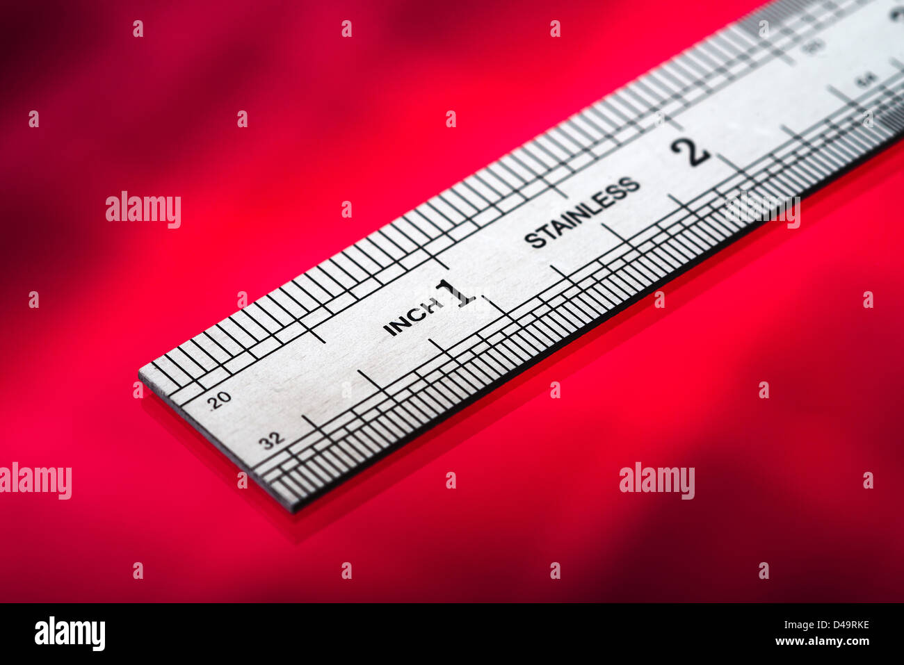 This is an image of a ruler, cut out over a red background Stock Photo ...