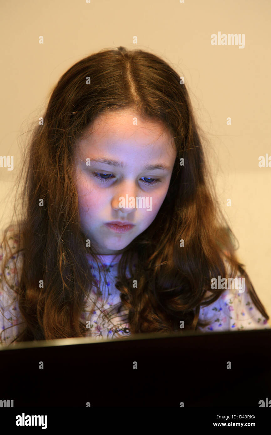 Young Girl using a Laptop Stock Photo - Alamy