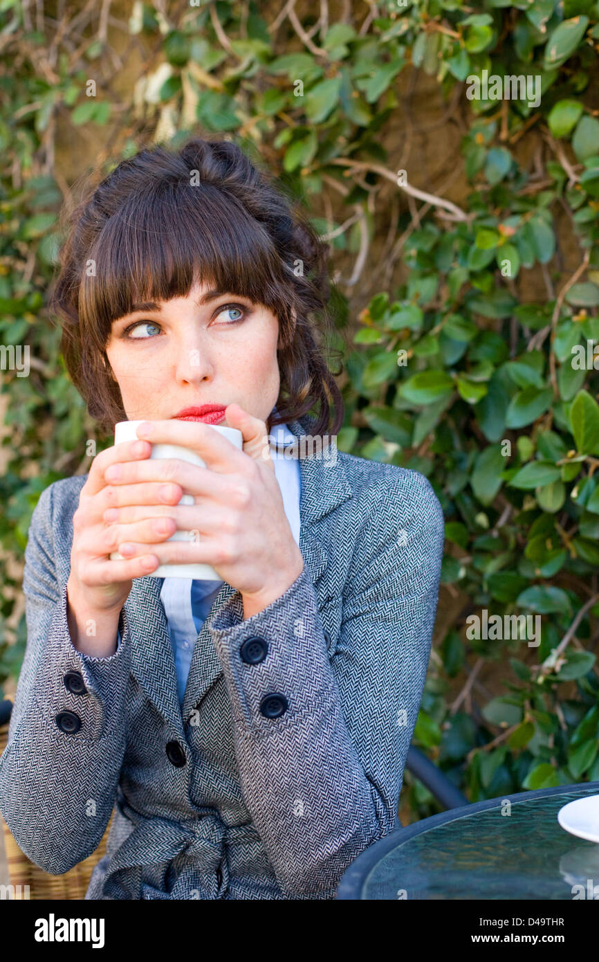 Attractive Young Business Woman Drinking Coffee At Outdoor Cafe Stock