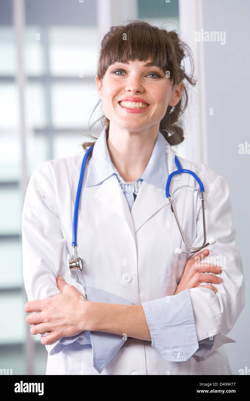 Female doctor arms crossed in a modern office Stock Photo - Alamy