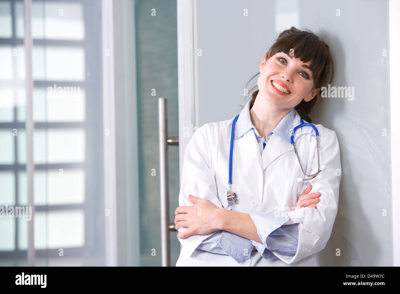 Female doctor arms crossed in a modern office Stock Photo - Alamy