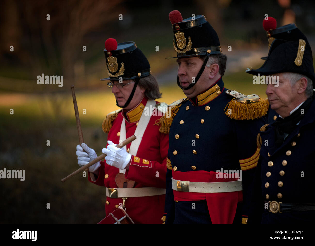 Members of the US Army Old Guard march during a ceremonial burial with ...