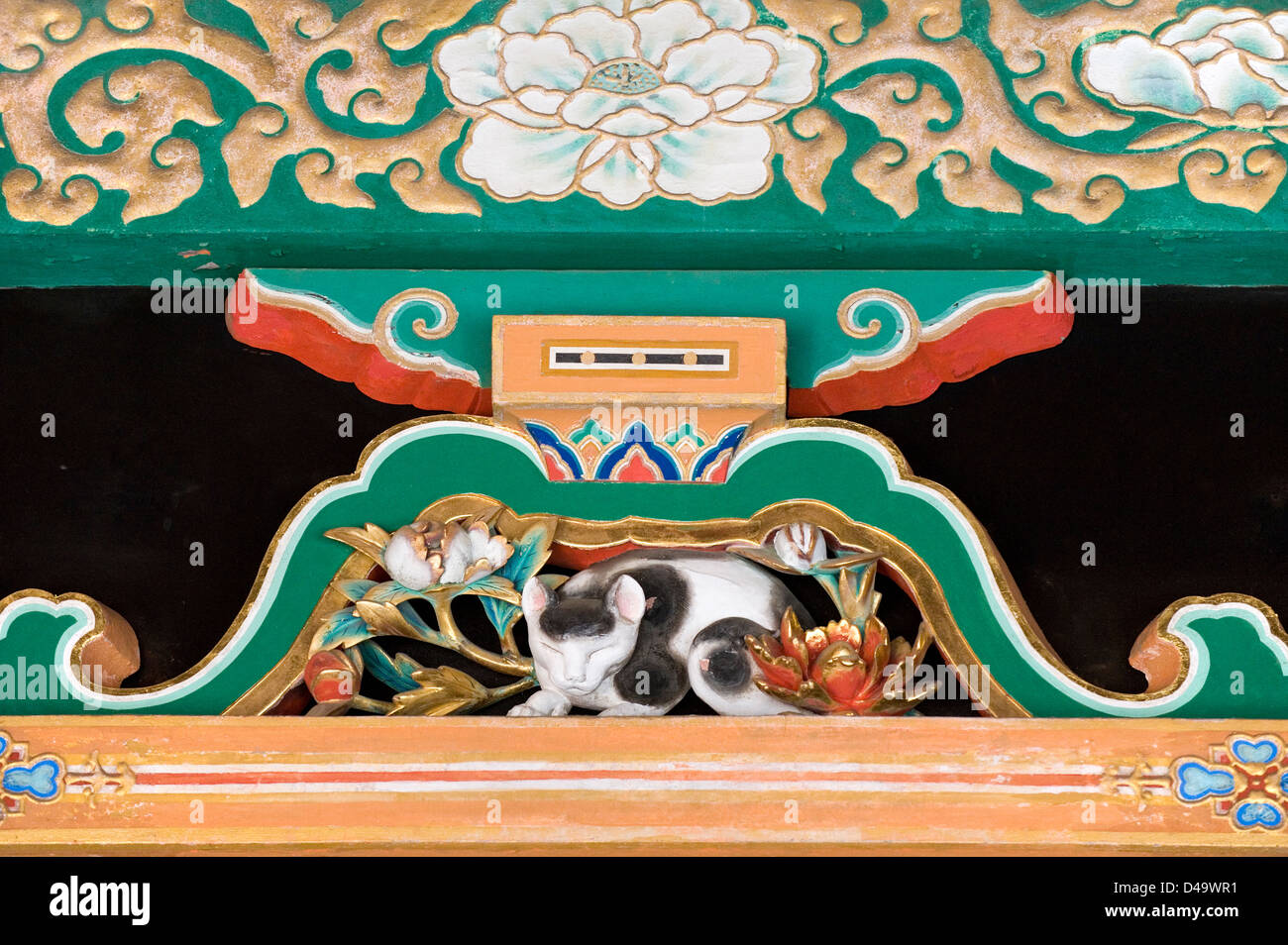 Carved painted wooden figure detail of famous "Nemuri Neko" (sleepy cat ...