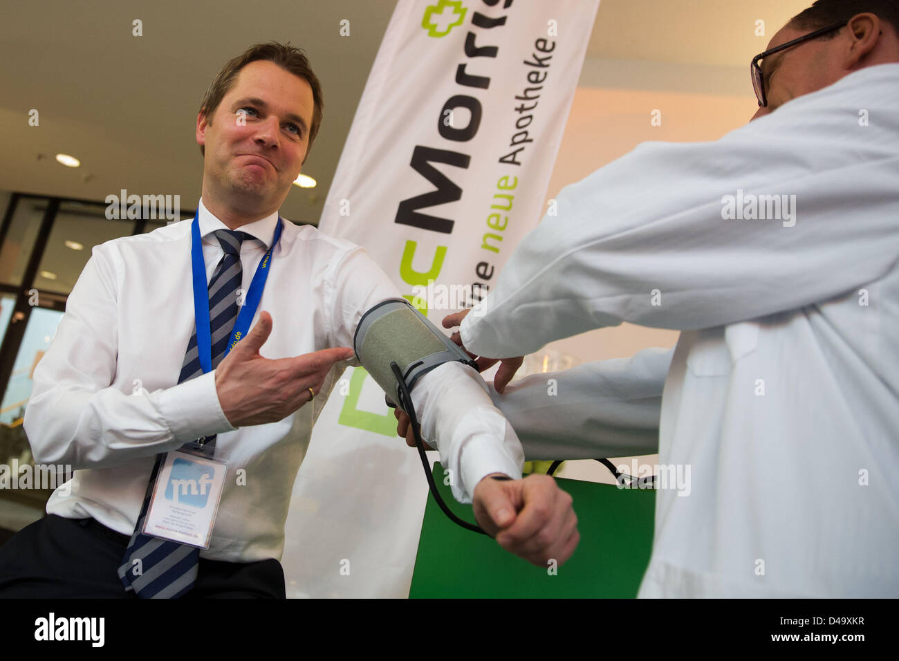 Berlin, Germany, 9th March, 2013German Health Minister Daniel Bahr smiles as a medical exhibitor ...